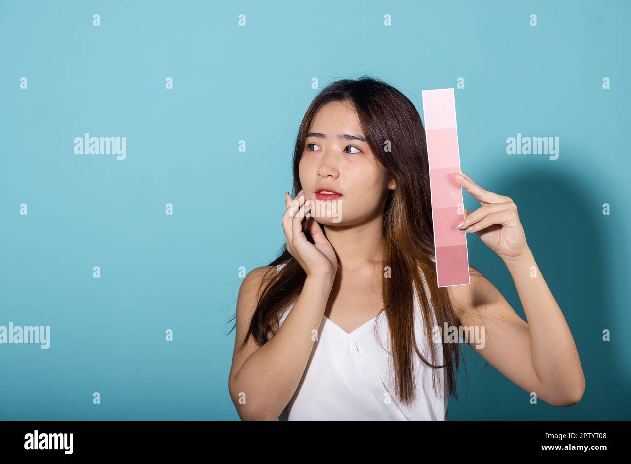Portrait of happy female hold color card under sun protection studio ...