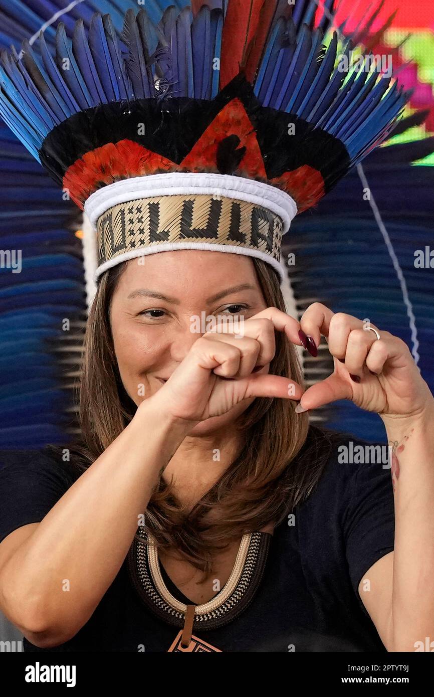 Brazilian first lady Rosangela Silva wears the headdress that was given ...