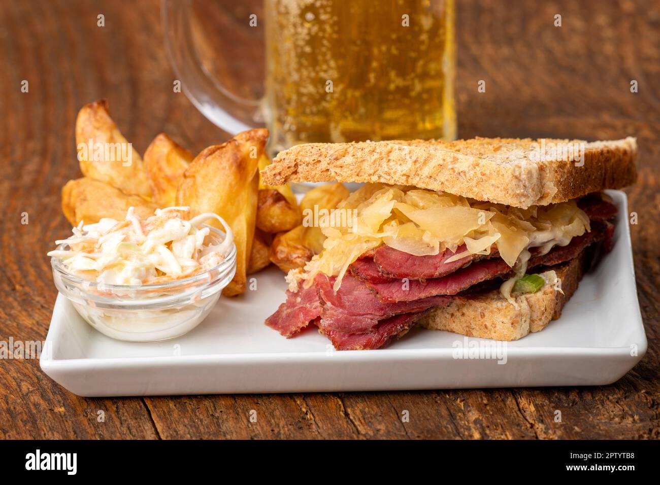 reuben sandwich on a plate with fries Stock Photo - Alamy