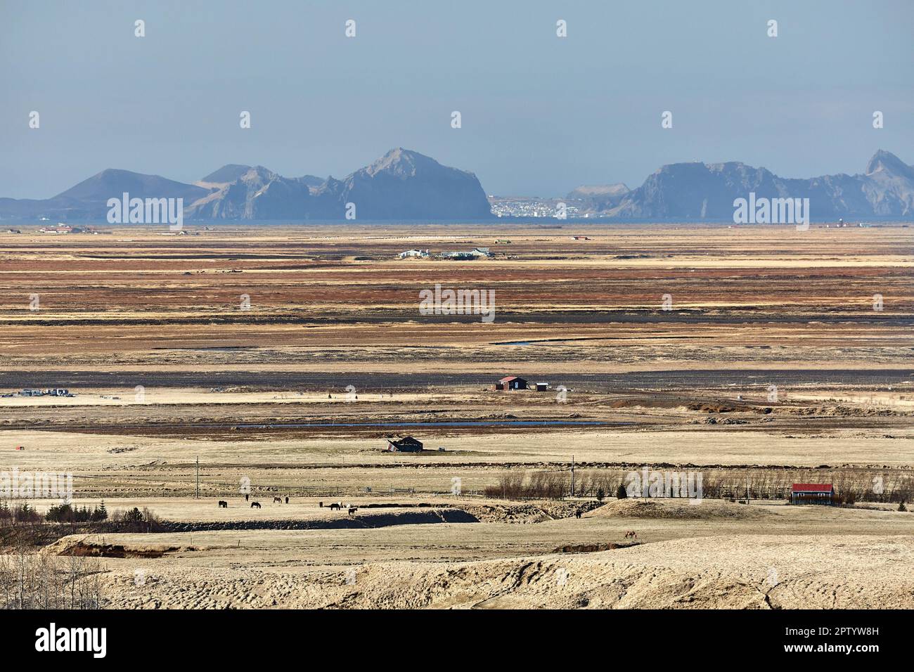 Icelandic plain landscape with cliffs of Vestmannaeyjar islands in the ...