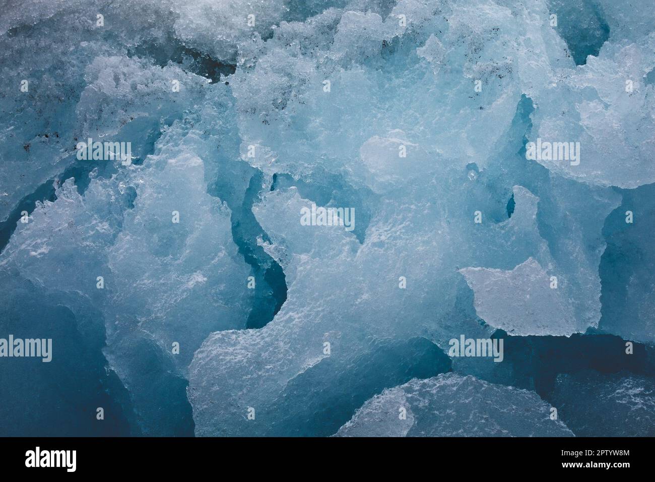 Ice blocks melting off an iceberg, icy shapes forming Stock Photo - Alamy