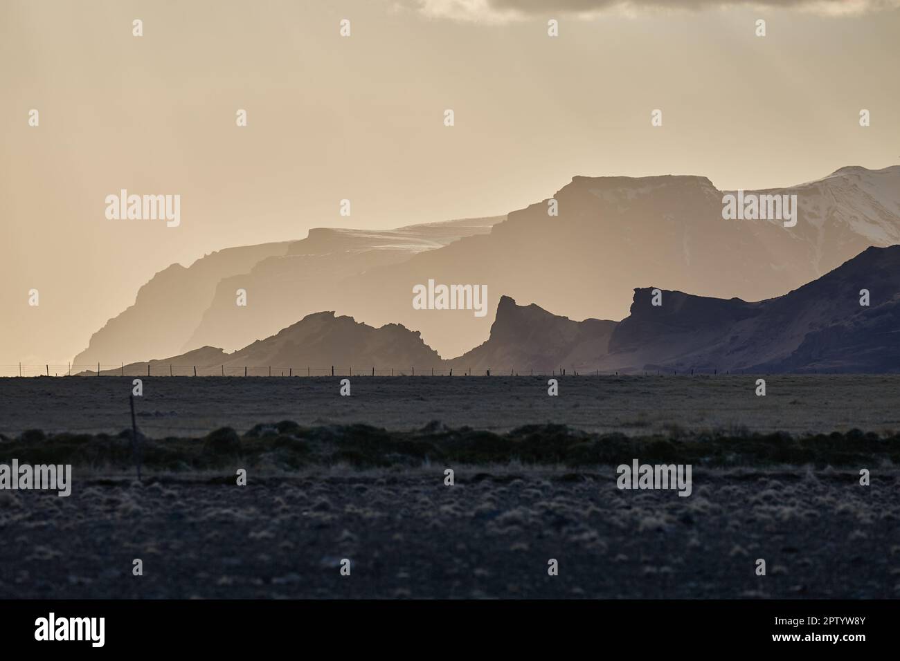 Twilight landscape with mountains and dim road Stock Photo - Alamy