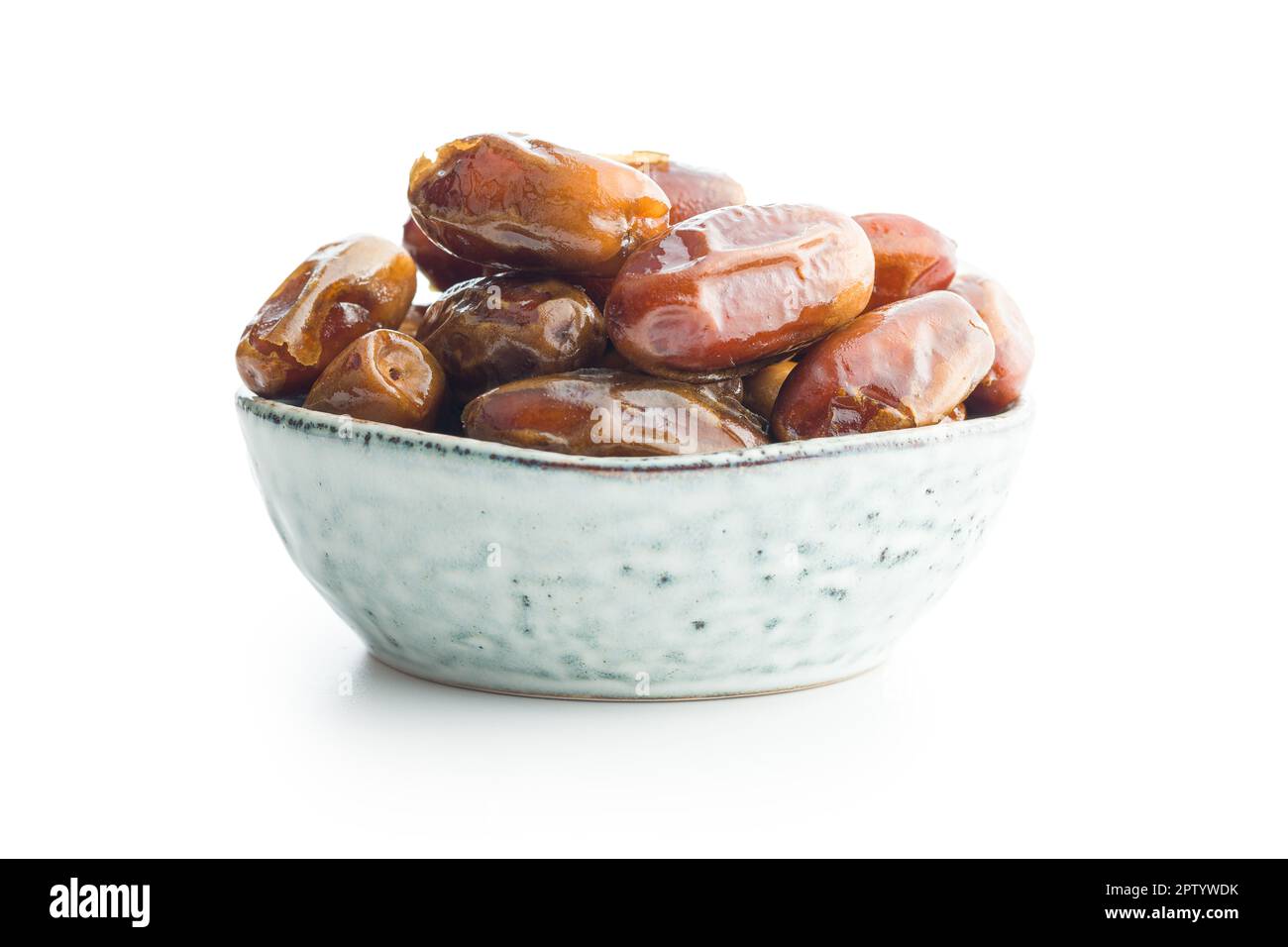 Dried dates fruit in bowl. isolated on the white background Stock Photo ...