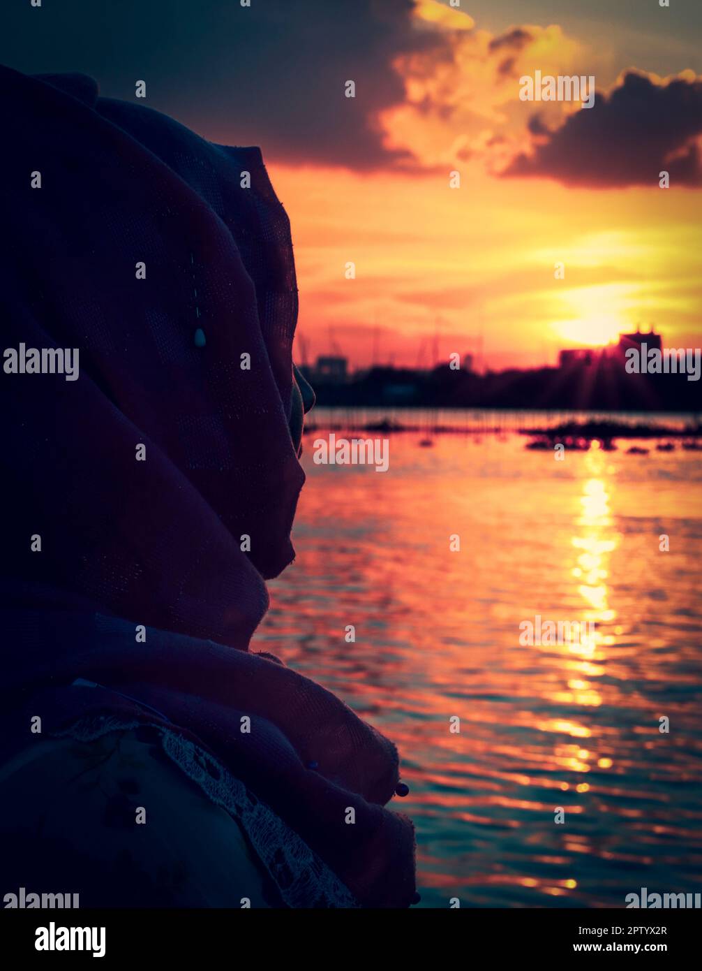 Woman river looking on sunset hi-res stock photography and images - Alamy