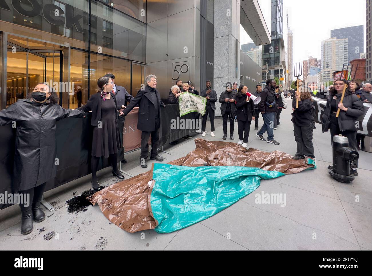 New York, USA. 28th Apr, 2023. Climate Change protestors throw black ...