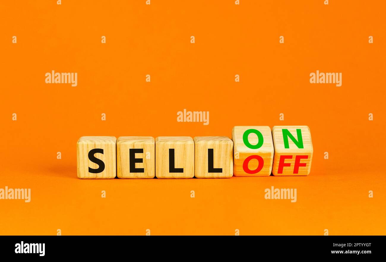 Sell on or off symbol. Businessman turns wooden cubes and changes word ...