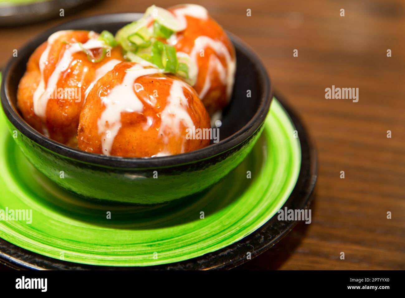 Japanese Takoyaki (filled with octopus) hot snack Stock Photo - Alamy