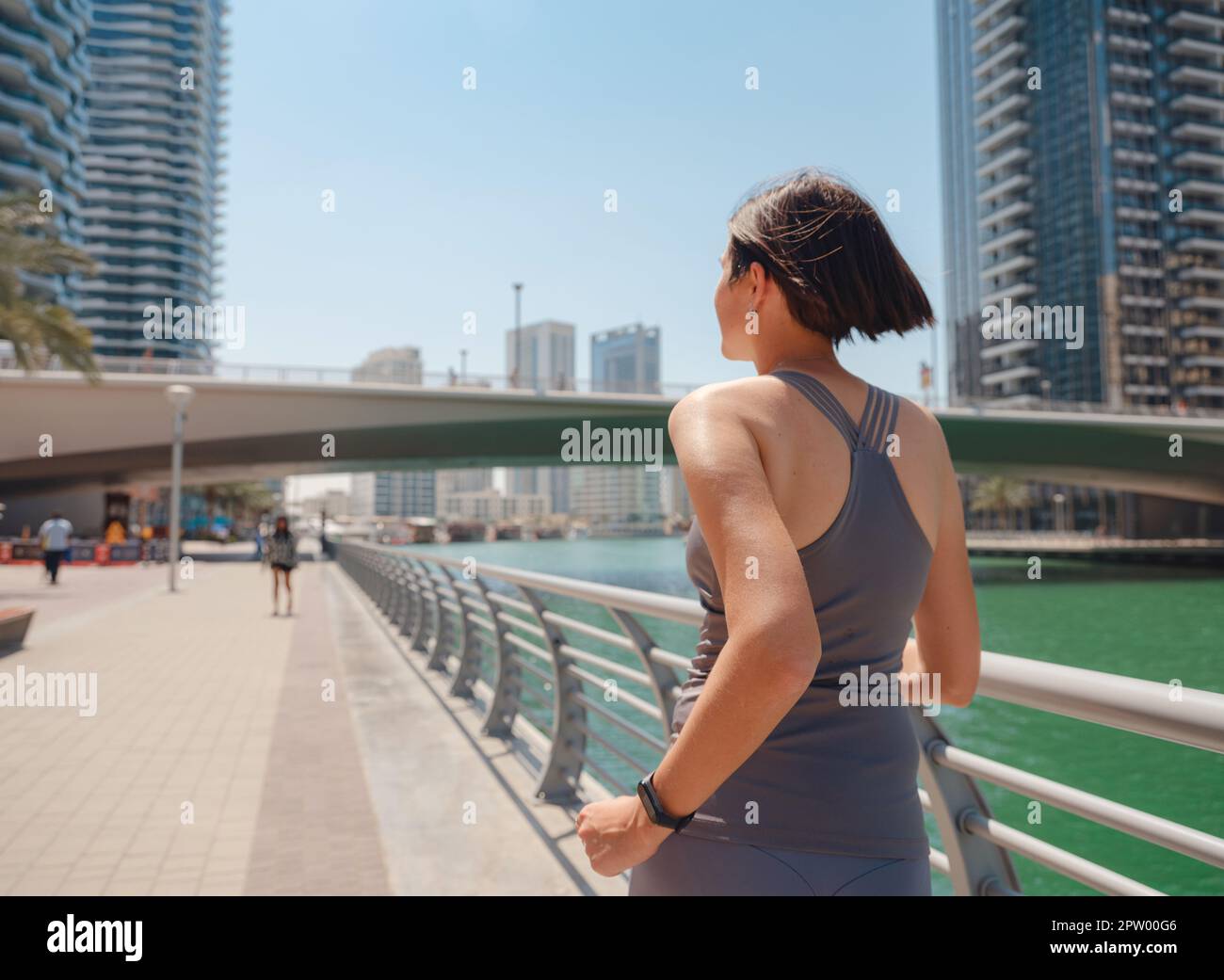 City Running - asian woman runner , Dubai marina urban scene in ...