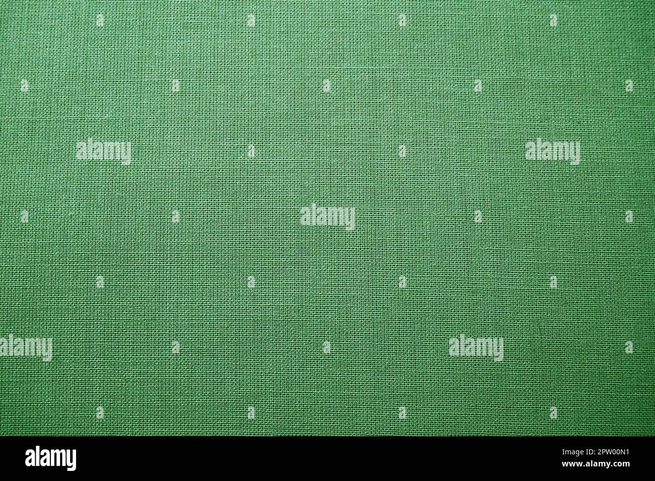 green background fabric texture. A piece of woolen cloth is neatly laid ...