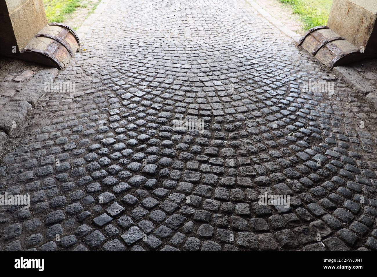 Paving stones - a hard road surface, a kind of pavement, lined with ...