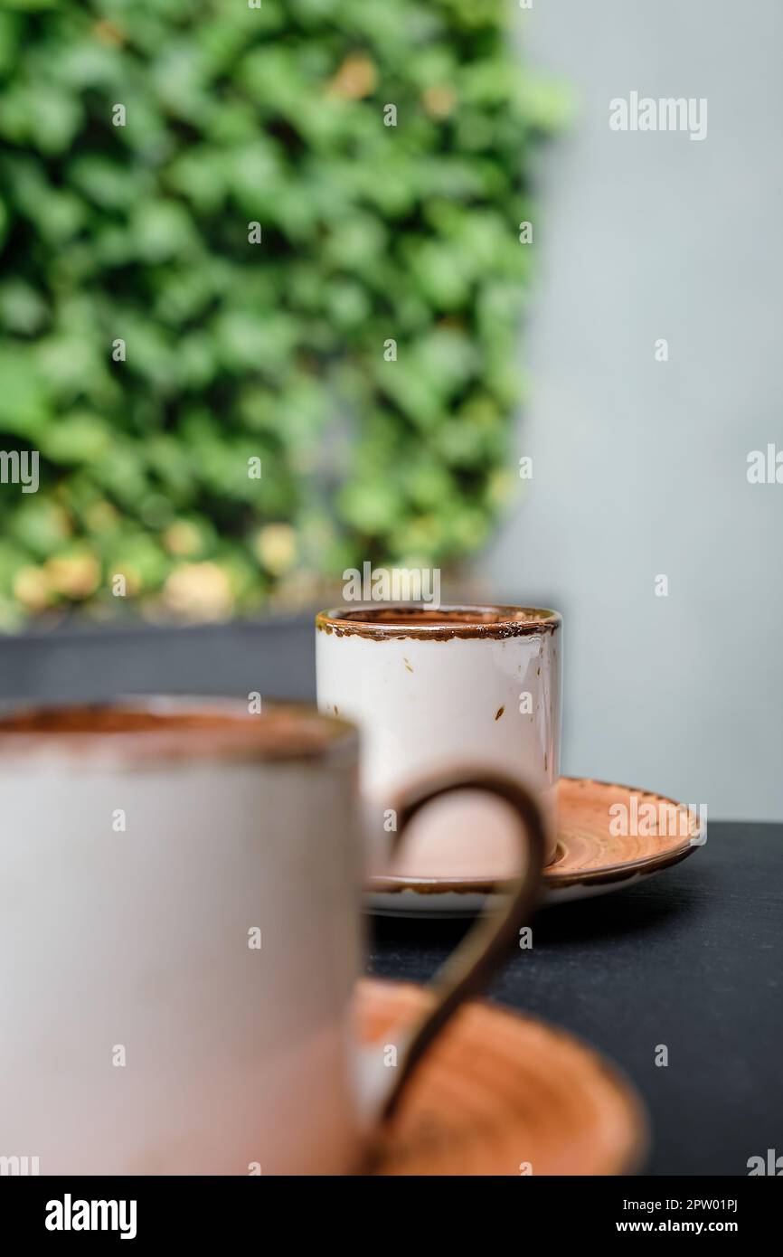 Focus on the far side of the espresso. Two cups of Turkish black frothy ...