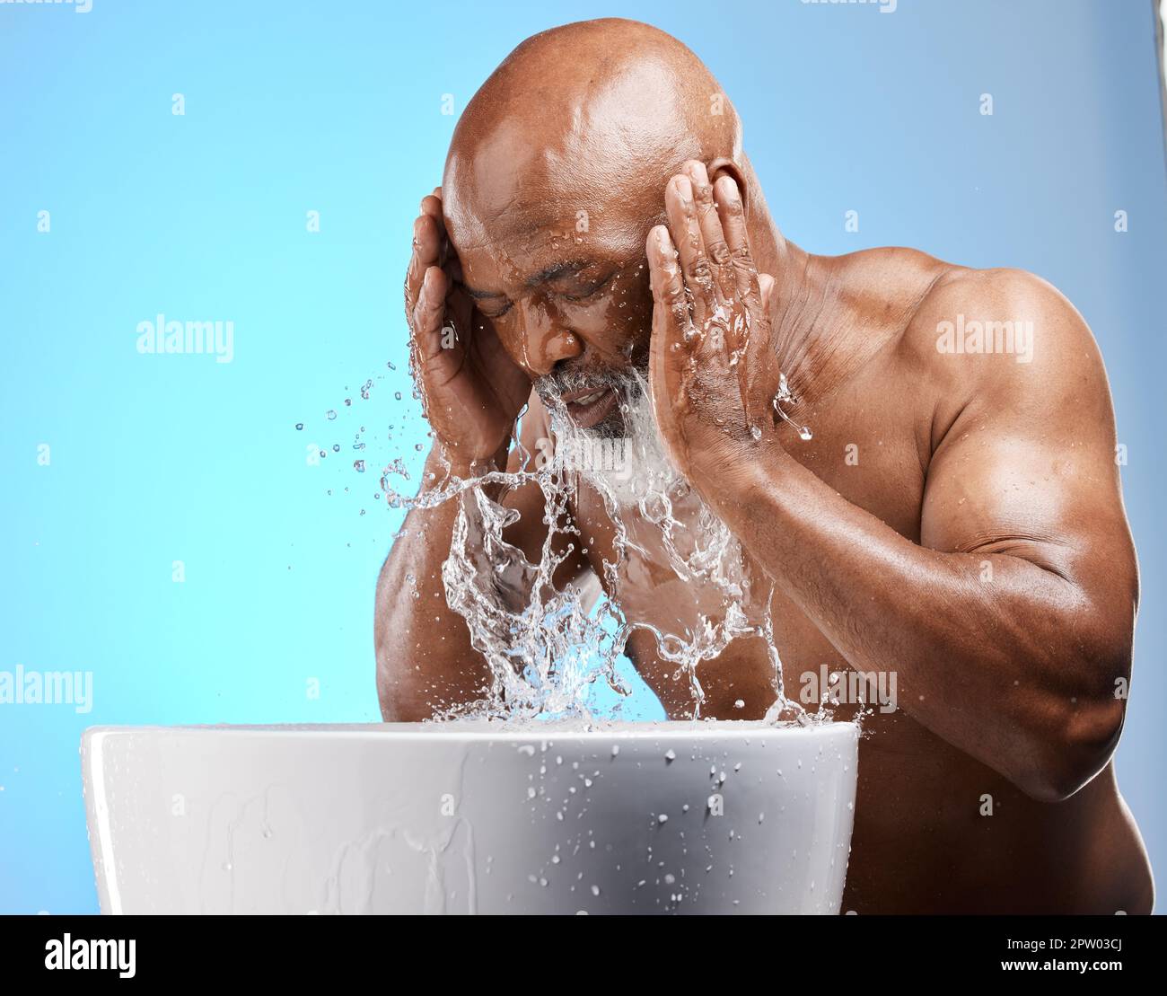 Skincare, water splash and black man for senior skincare while washing ...