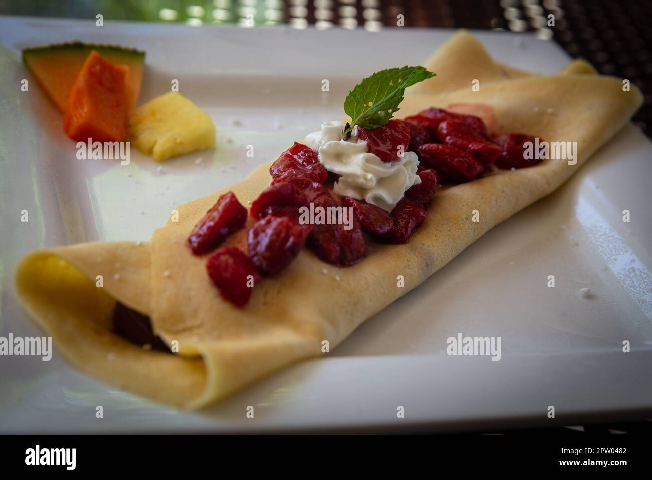 Strawberry Crepe with Chocolate Filling topped with whip cream Stock ...