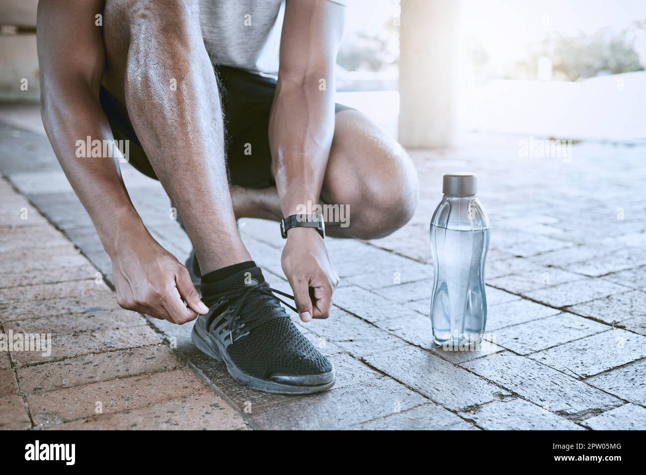 Shoes, water bottle and hand of runner for motivation and in fitness ...