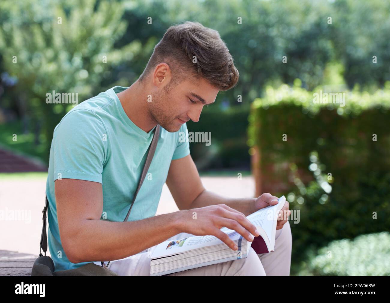 Final revision before the test. A young student sitting on campus ...