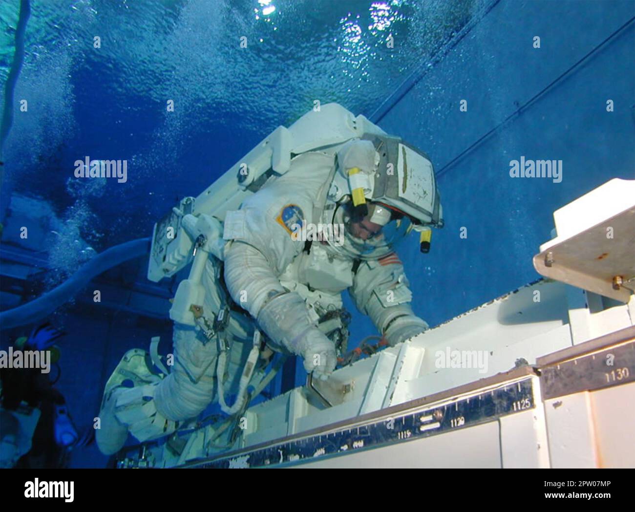 NASA astronaut under training in the Neutral Buoyancy Laboratory at the ...