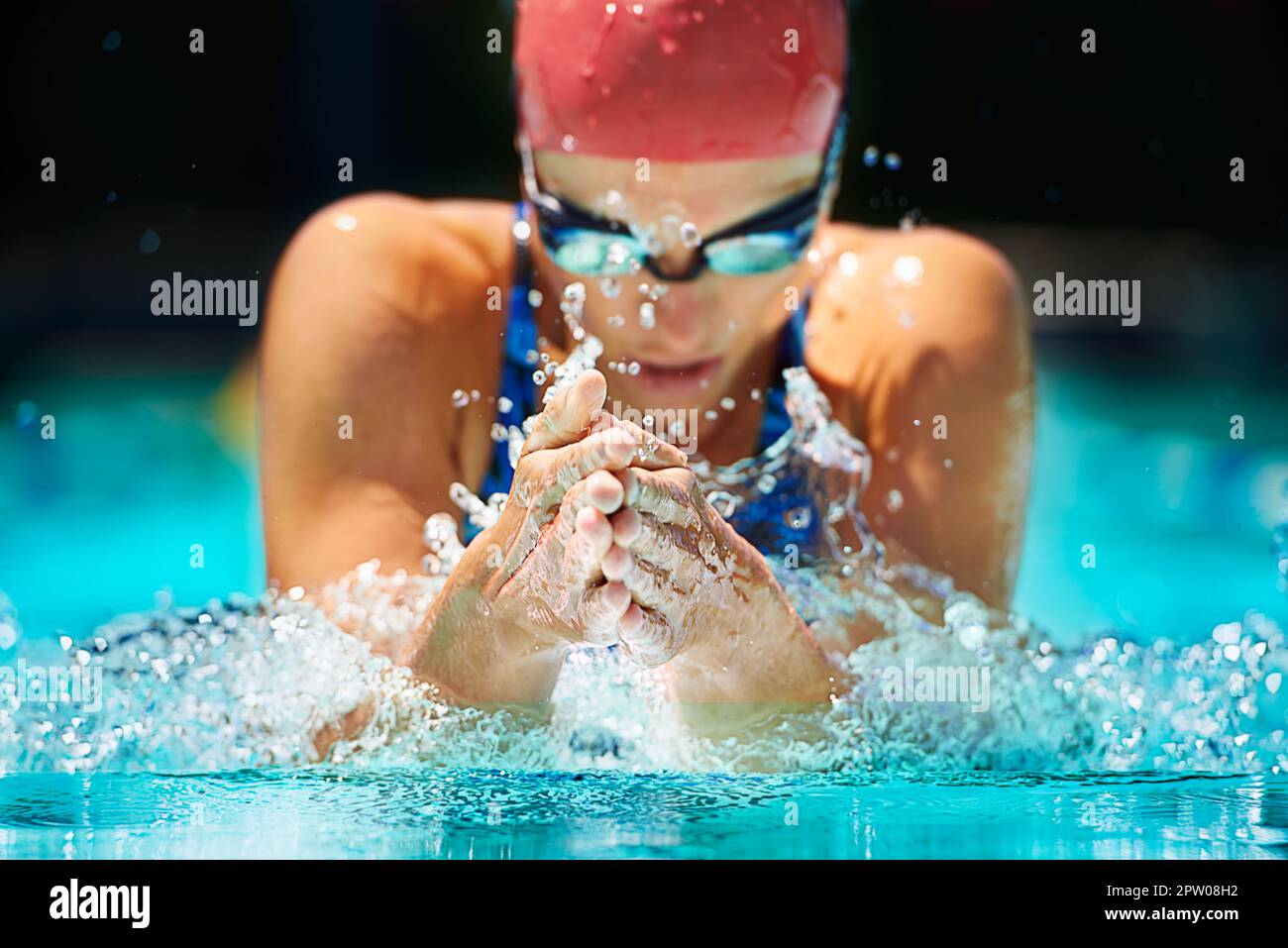 The hardest stroke in swimming...a young female swimmer doing the ...