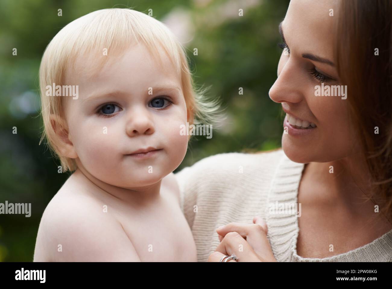 Safe in his mothers love. a young boy and his mother Stock Photo - Alamy