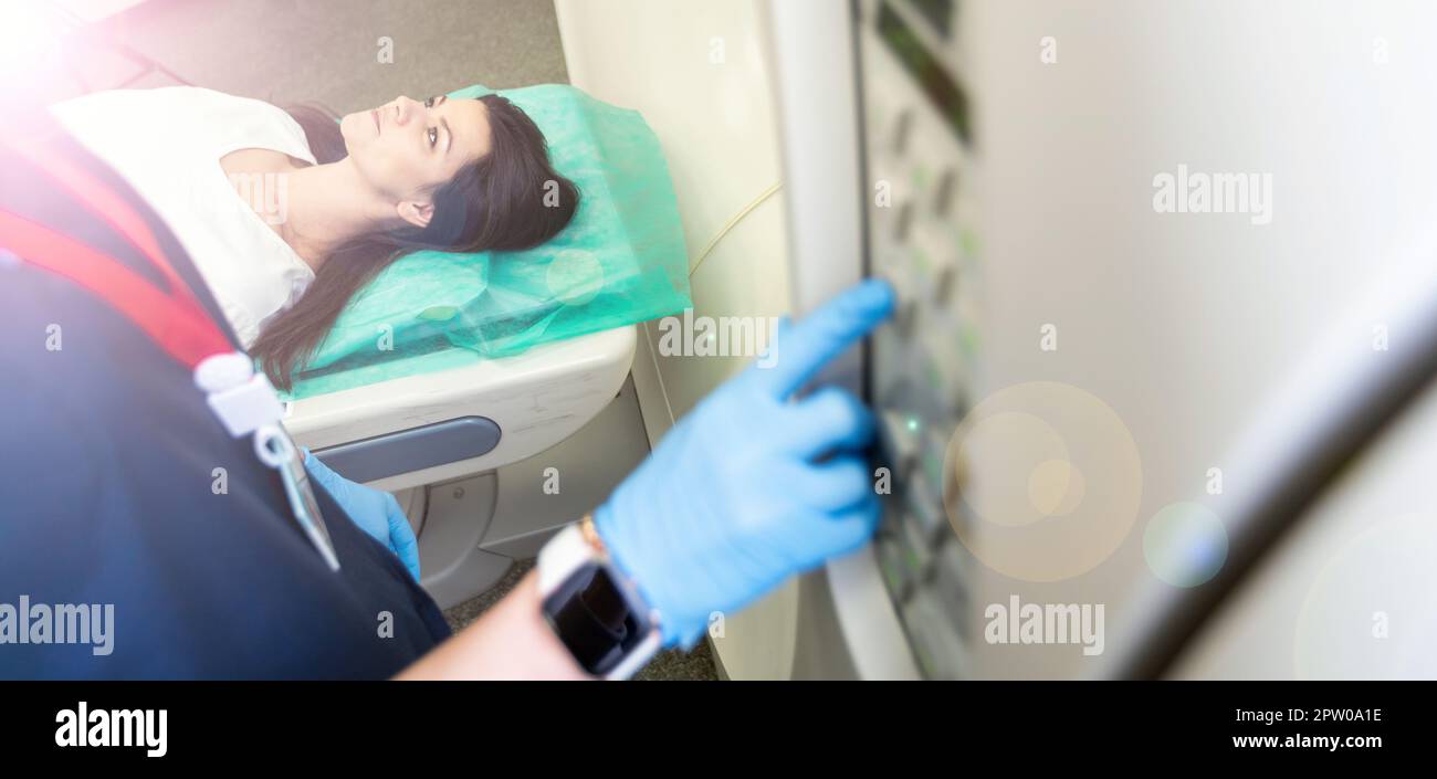 beautiful woman lying on ct scanner bed during tomography test in ...