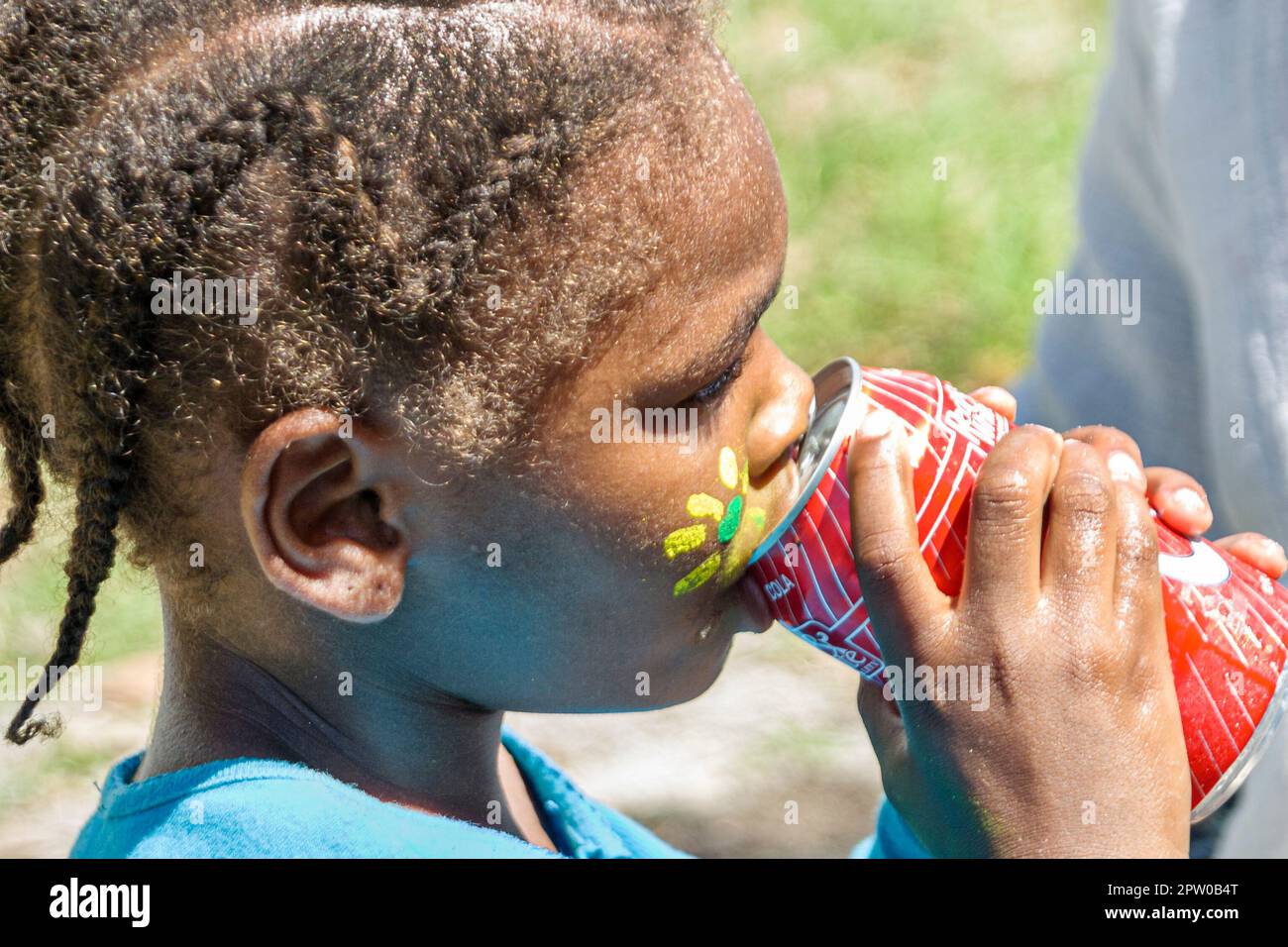 Picnic black afican girl female drinking canned soda cola hi-res stock ...