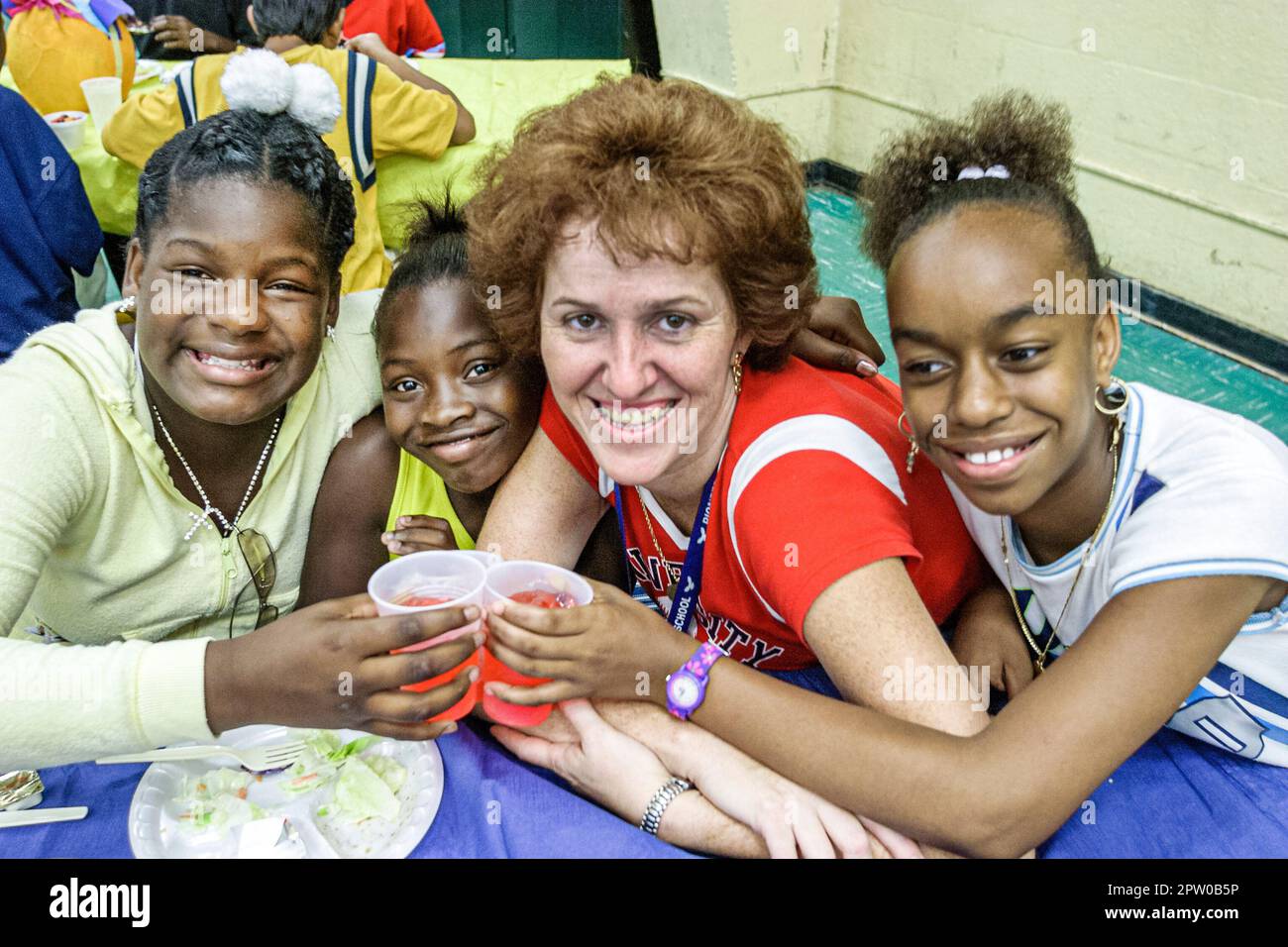 Inner city cafeteria black african girl girls female teacher woman hi ...