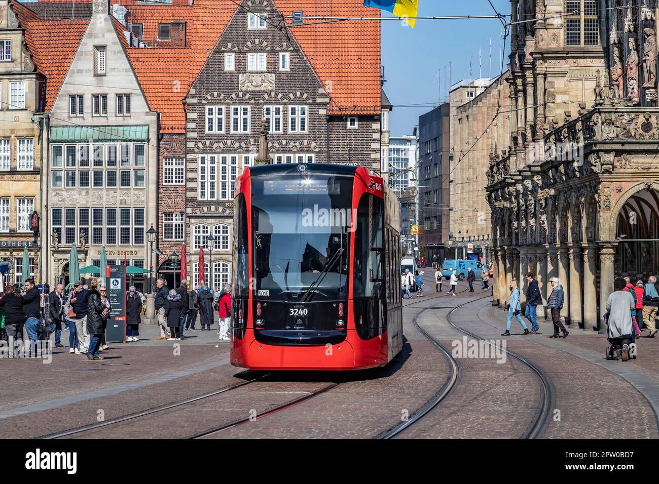 Tram going alongside The Townhall on the edge of the market square in ...