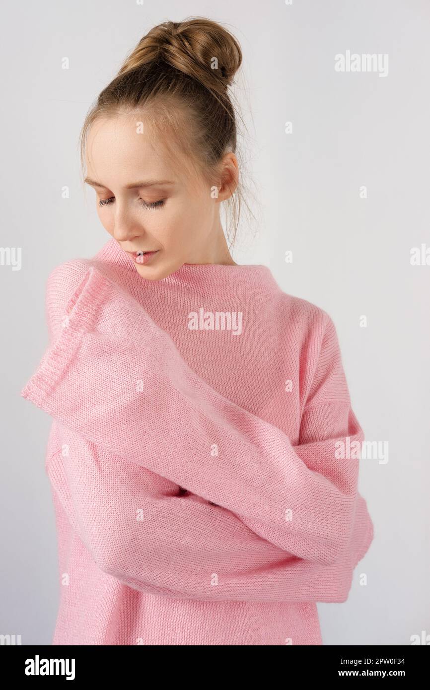 Pretty girl in thin angora sweater Stock Photo - Alamy