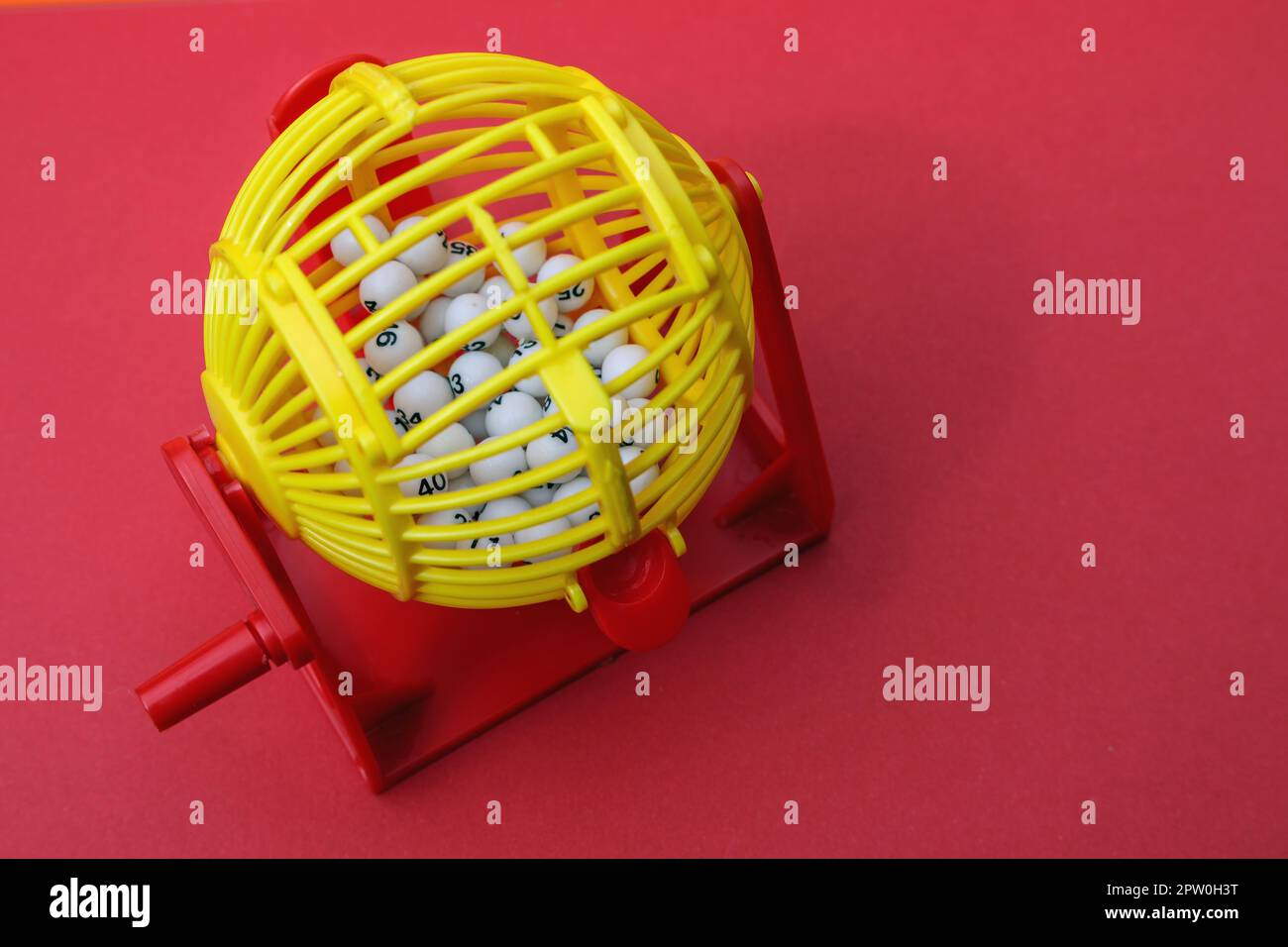 A jolly bright plastic basket with numbers to help with the Lottery ...