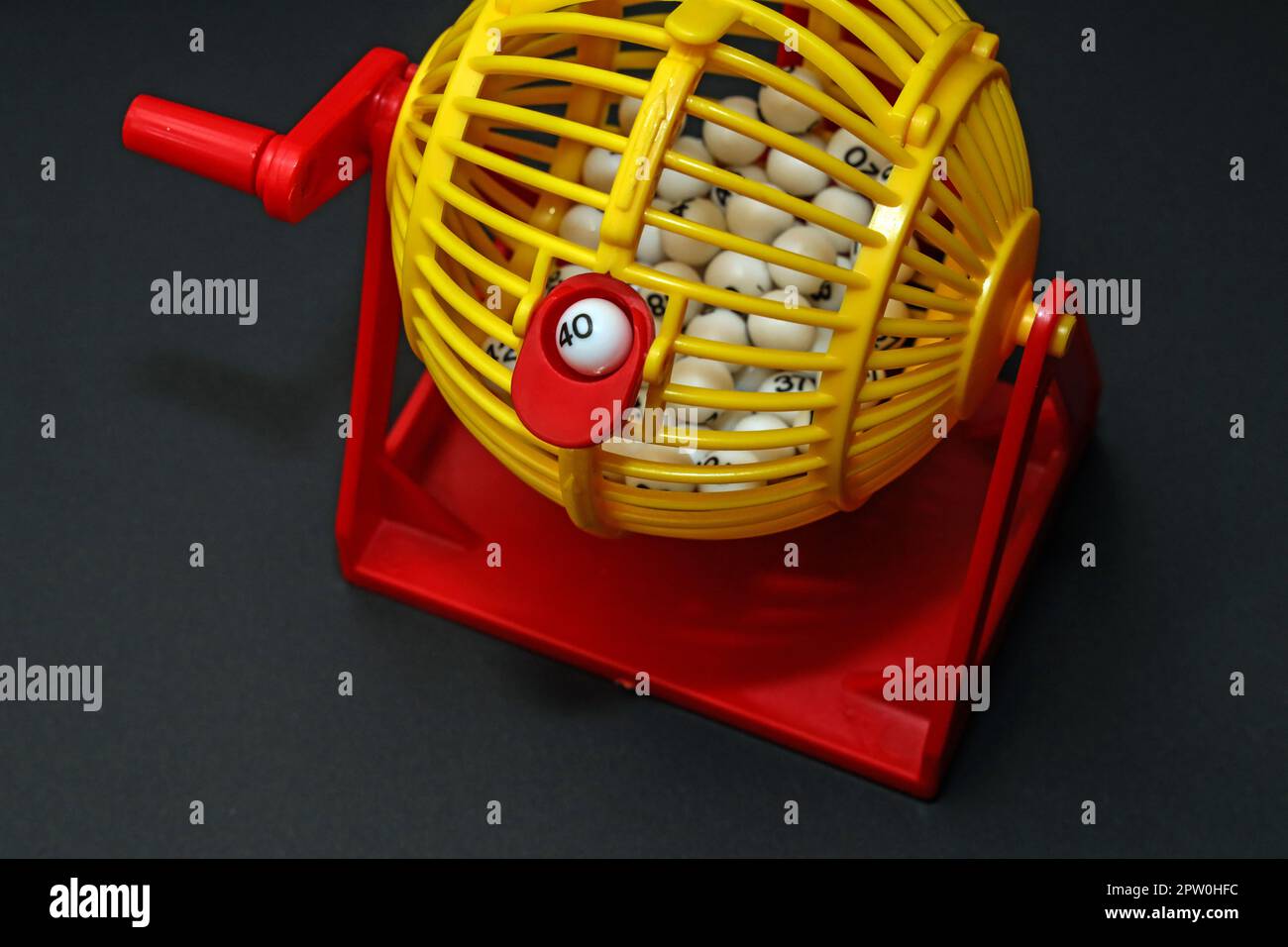 A jolly bright plastic basket with numbers to help with the Lottery ...