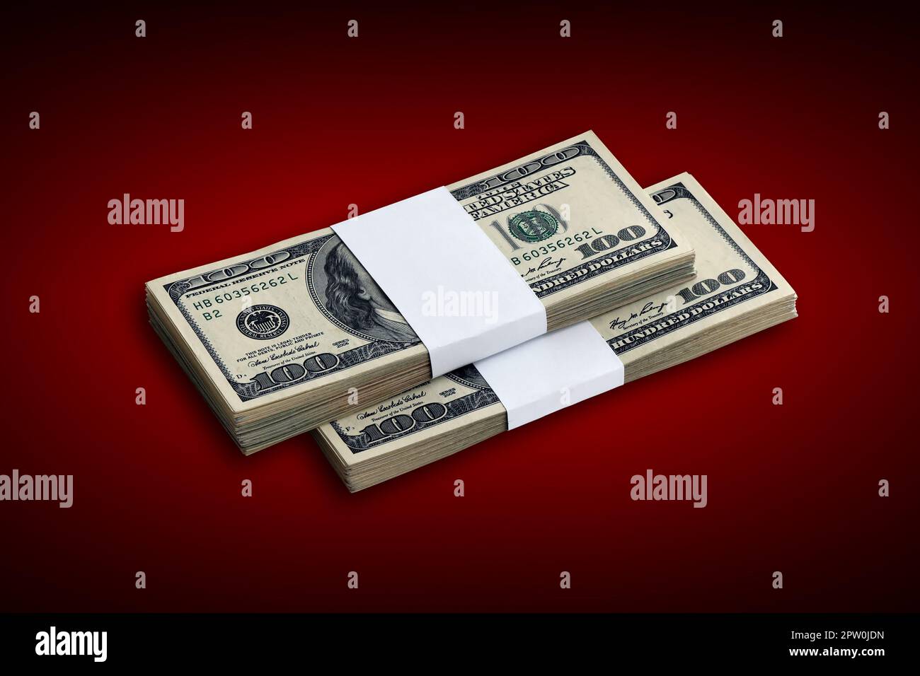 Bundle of US dollar bills on crimson red background. Pack of american ...