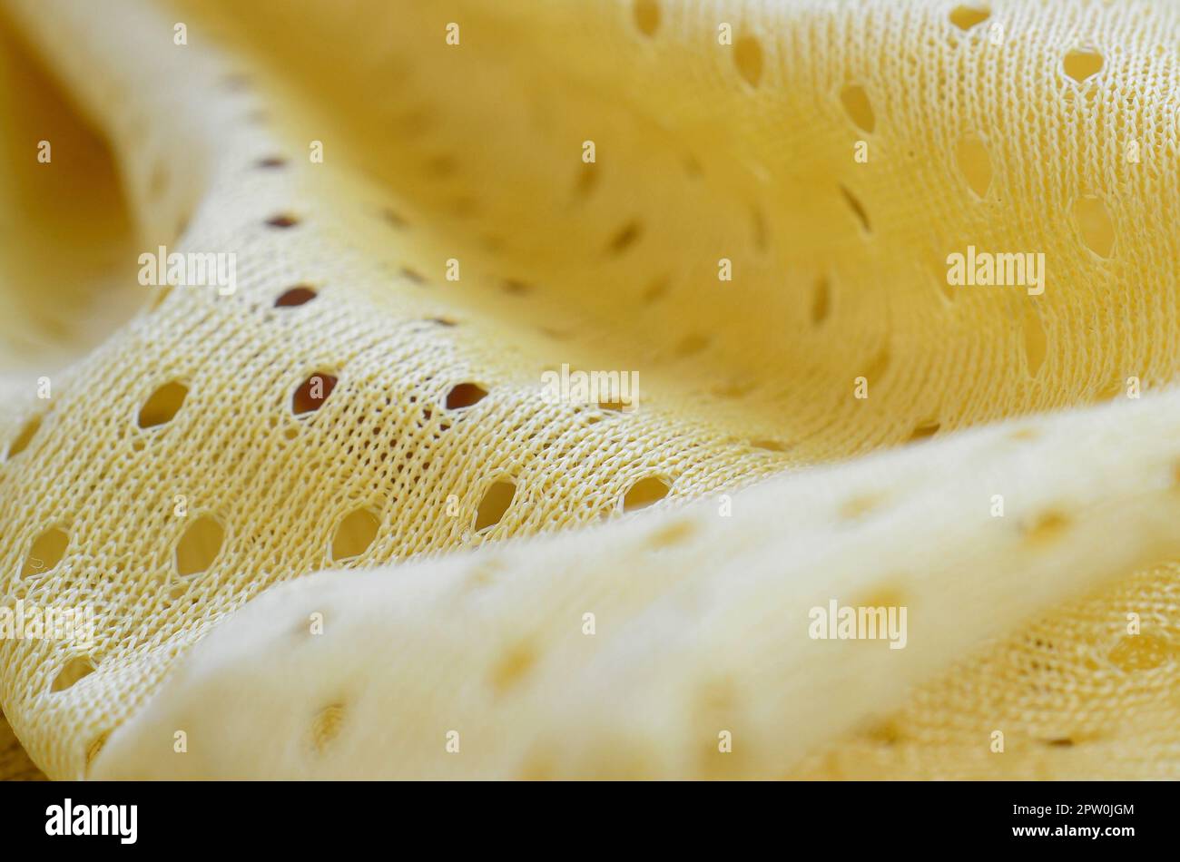 Yellow mesh sport wear fabric textile pattern background. Yellow color ...