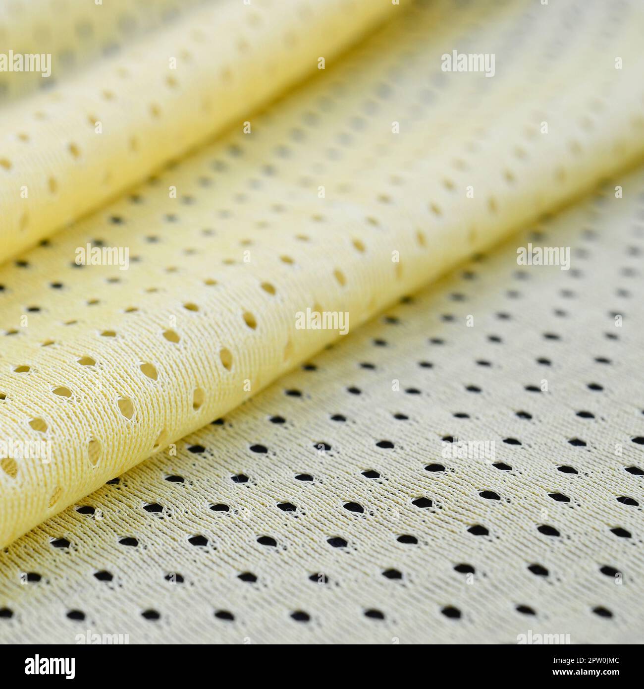 Yellow mesh sport wear fabric textile pattern background. Yellow color ...