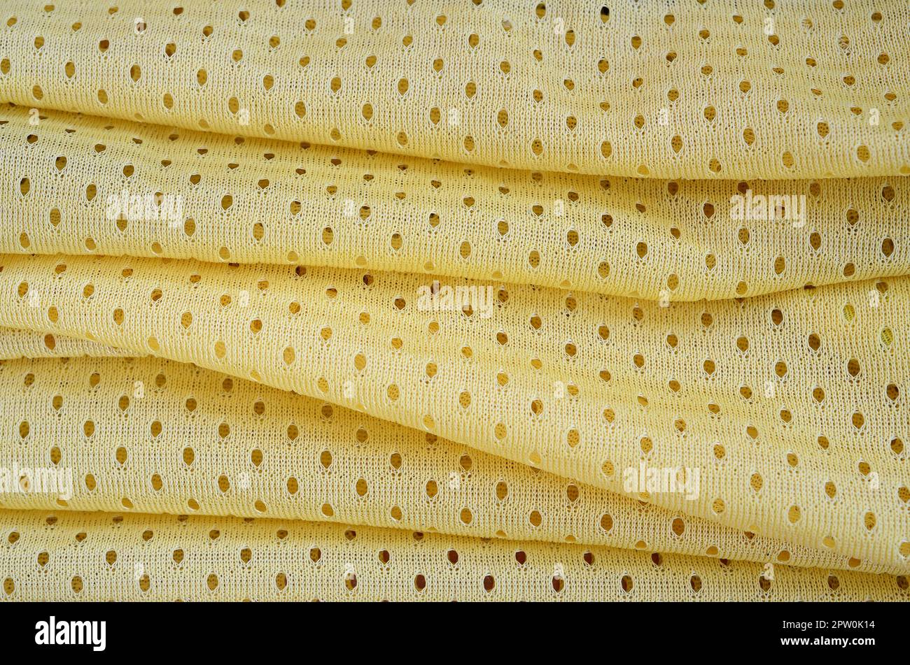 Yellow mesh sport wear fabric textile pattern background. Yellow color ...