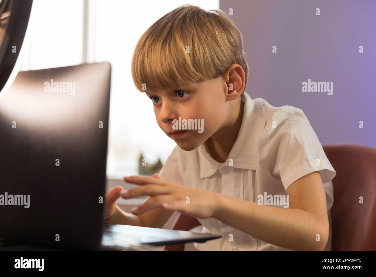 Boy school typing children hi-res stock photography and images - Alamy