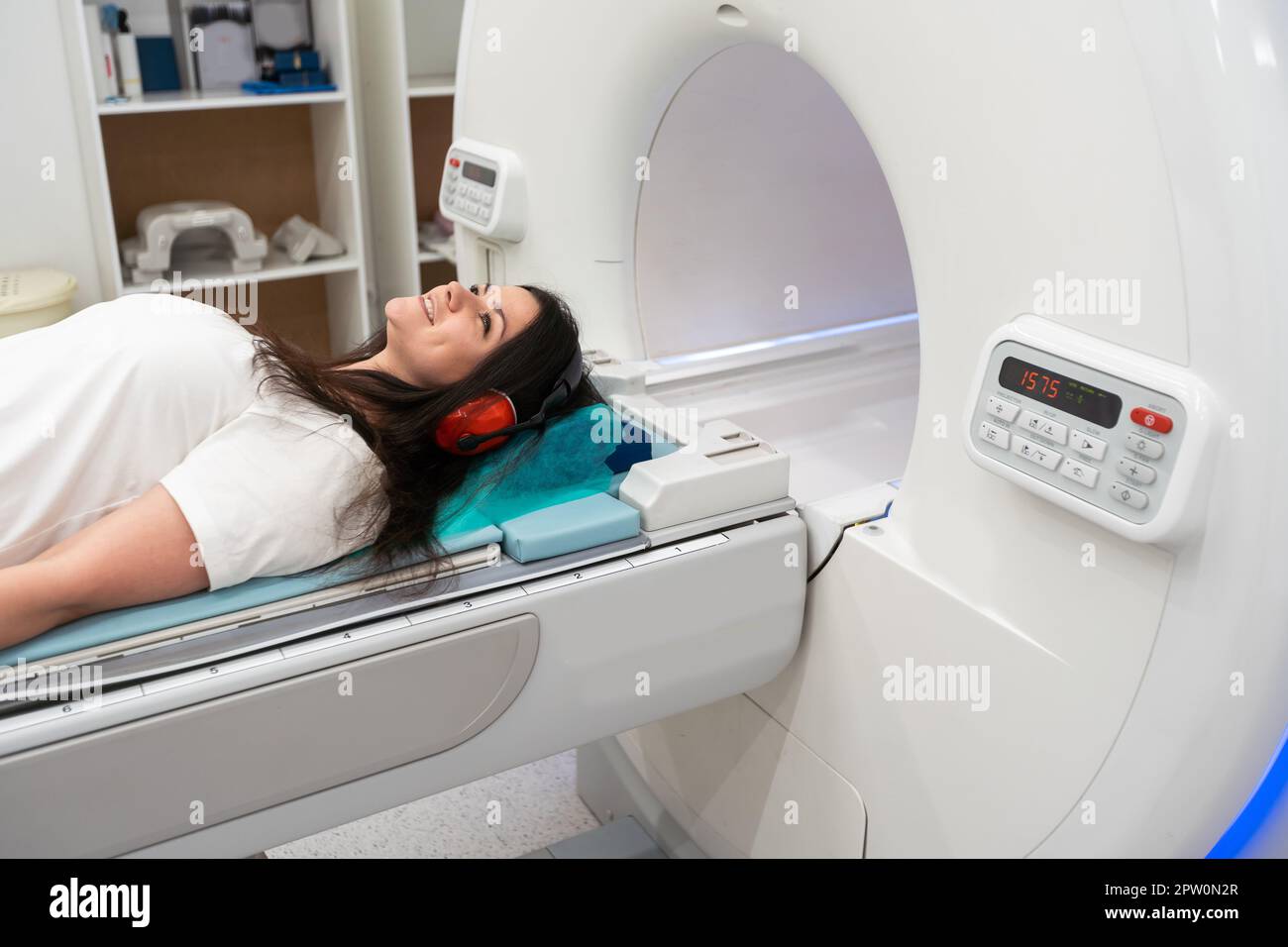 Female patient undergoing MRI - Magnetic resonance imaging in Hospital ...
