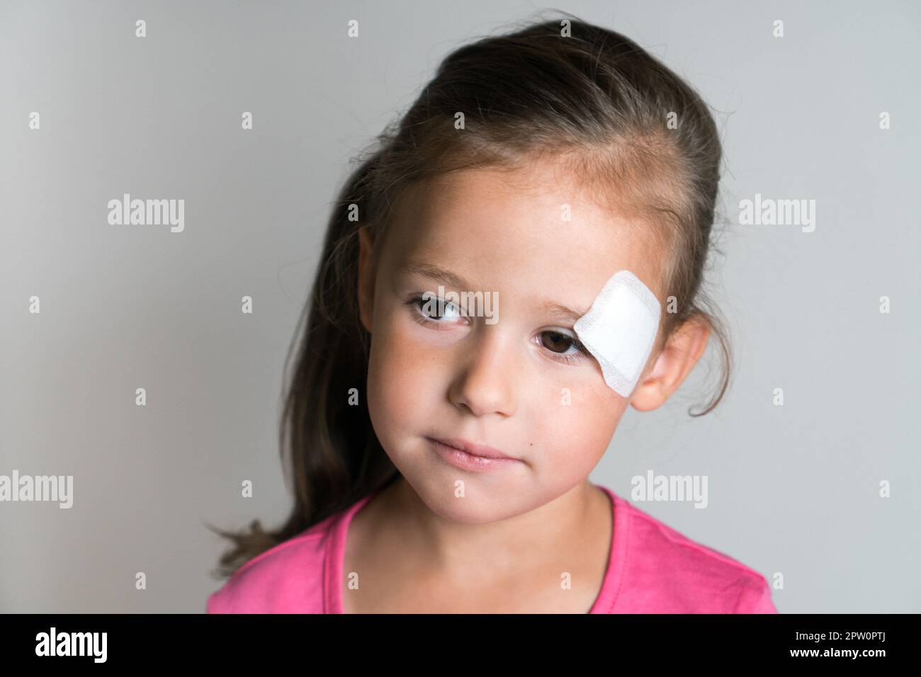 Close up sad, nice, lovely, adorable dark haired little child, girl ...
