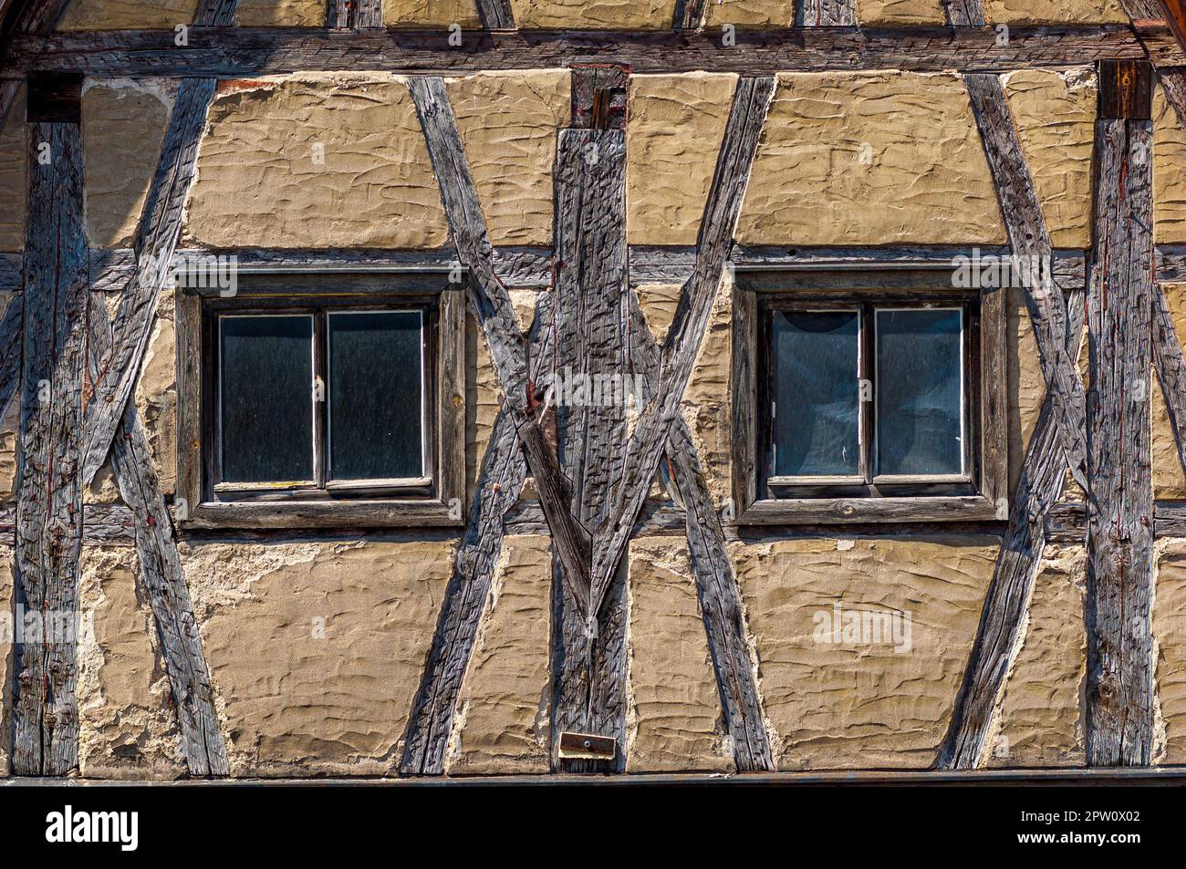 The facade of a half-timbered house with its wooden beams and frames in ...