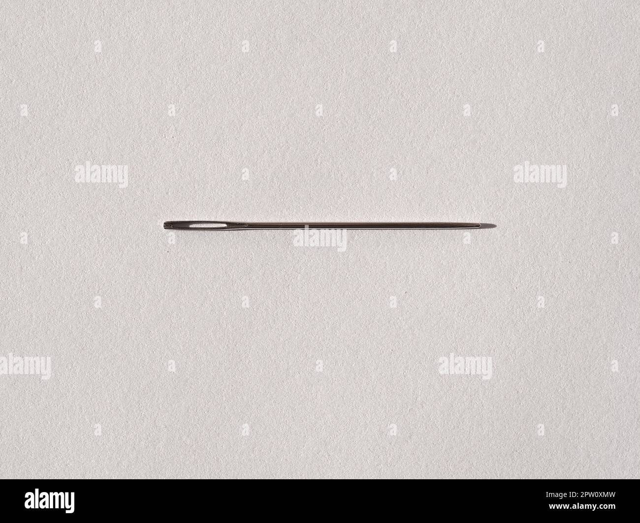 needle for sewing over a white background Stock Photo - Alamy
