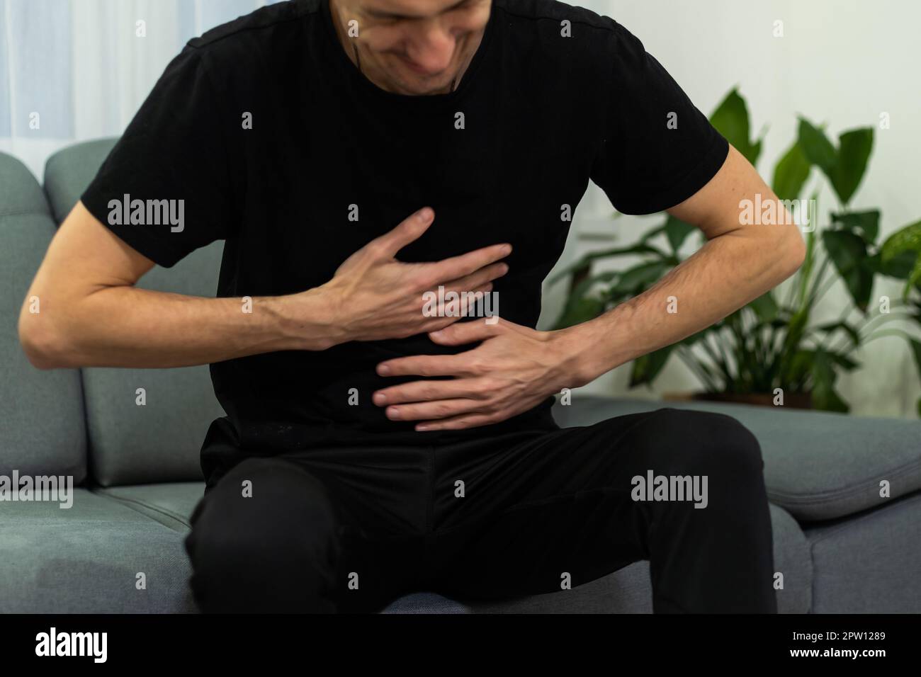 American Guy Having Stomachache After Eating Pizza Touching Aching ...