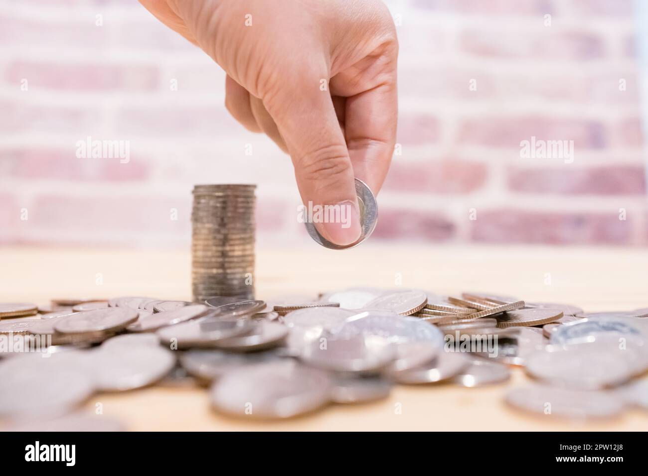 Images of growing stacking coins and Hand holding coin for planning ...