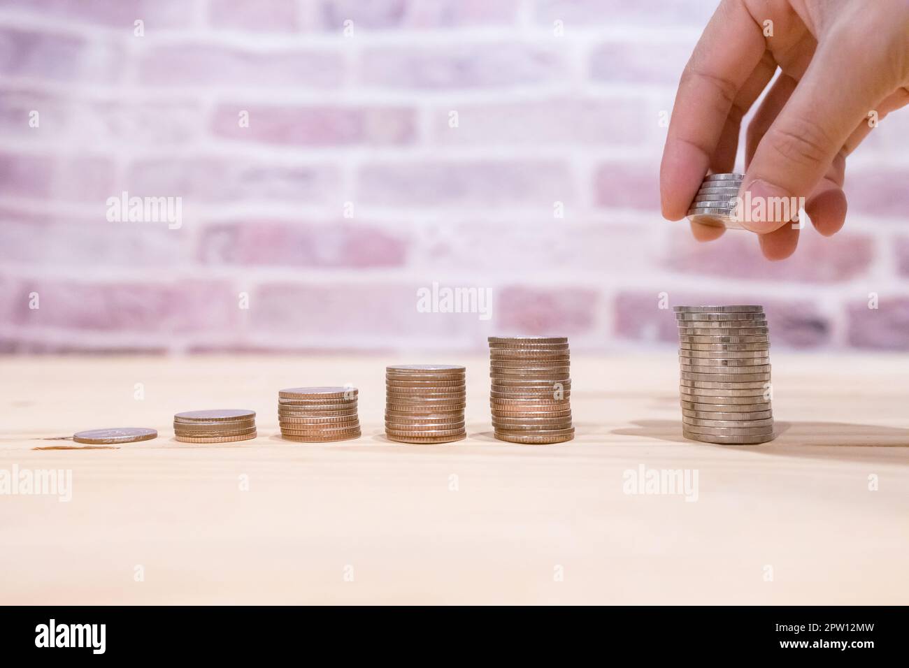 Images of growing stacking coins and Hand holding coin for planning ...