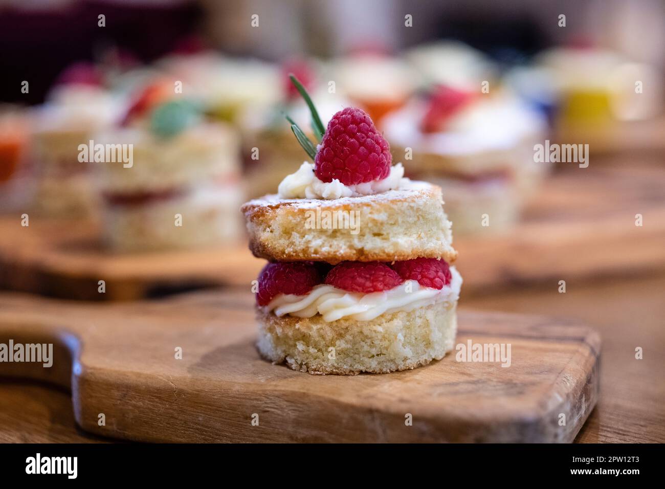 Beautiful mini Victoria sponges, fresh fruit of raspberries filled with ...
