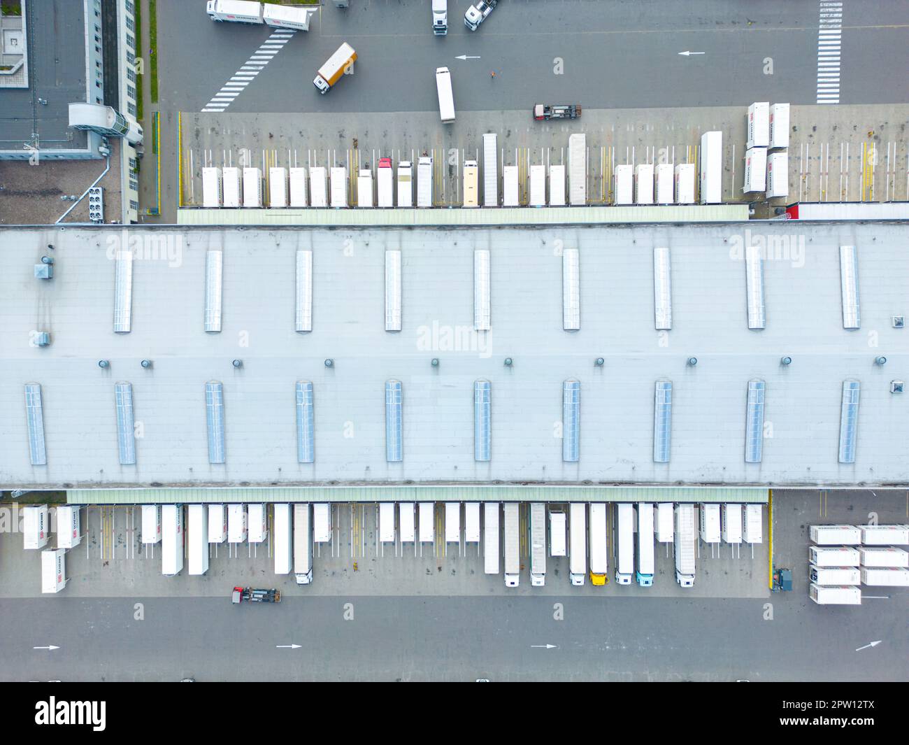 Logistics park with warehouse. Semi-trailers trucks standing on car ...