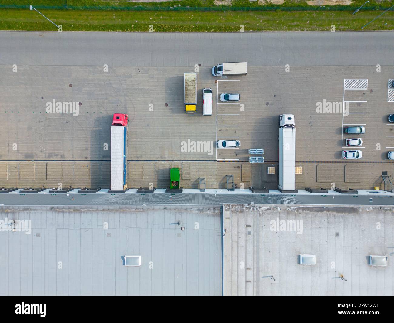 Logistics park with warehouse. Semi-trailers trucks standing on car ...