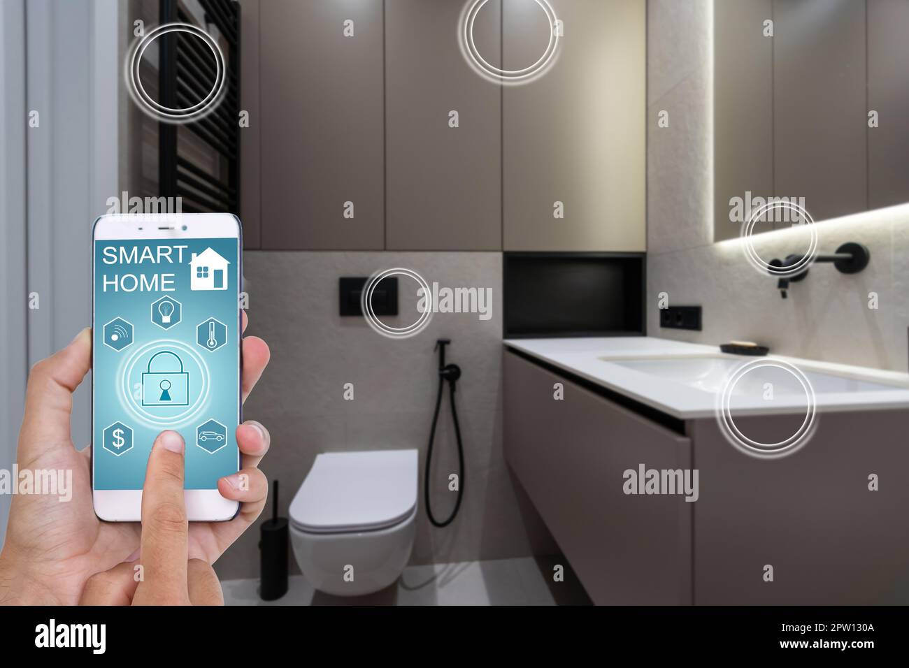 All the house in a phone. Close up of young woman user hands ...