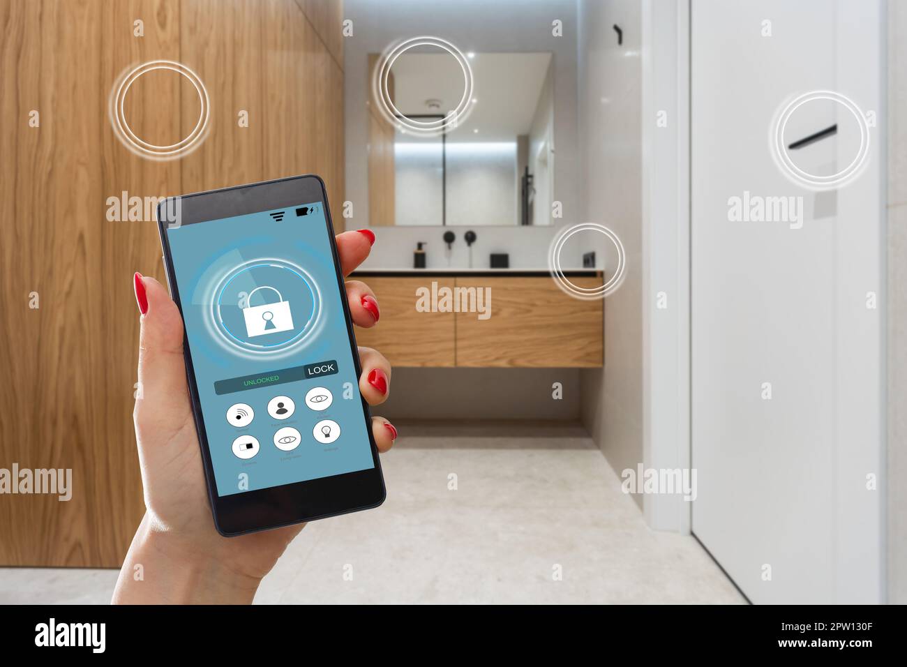 man hand holding phone with app smart home in room house Stock Photo ...