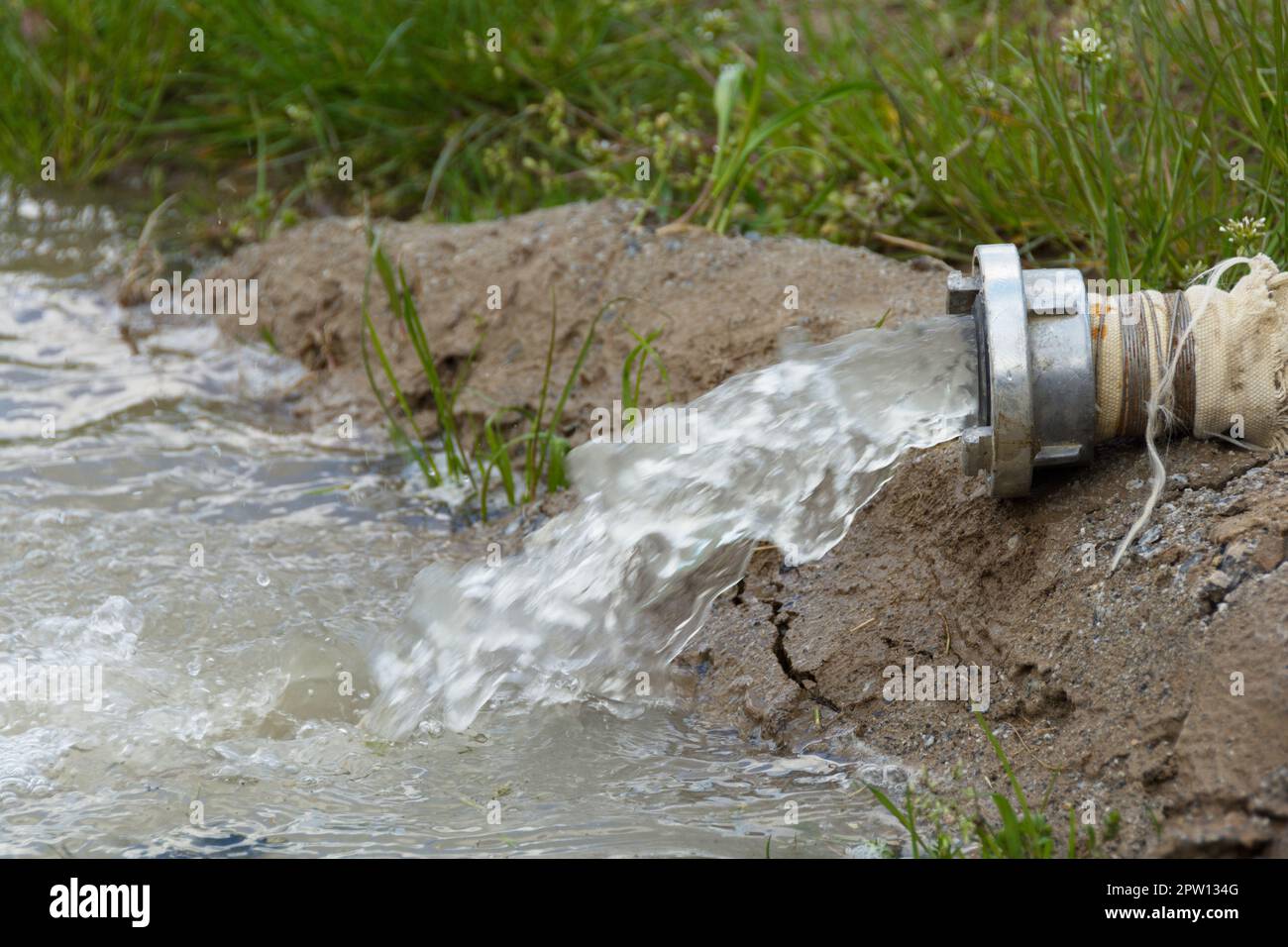 Water jet from fire hose Stock Photo - Alamy