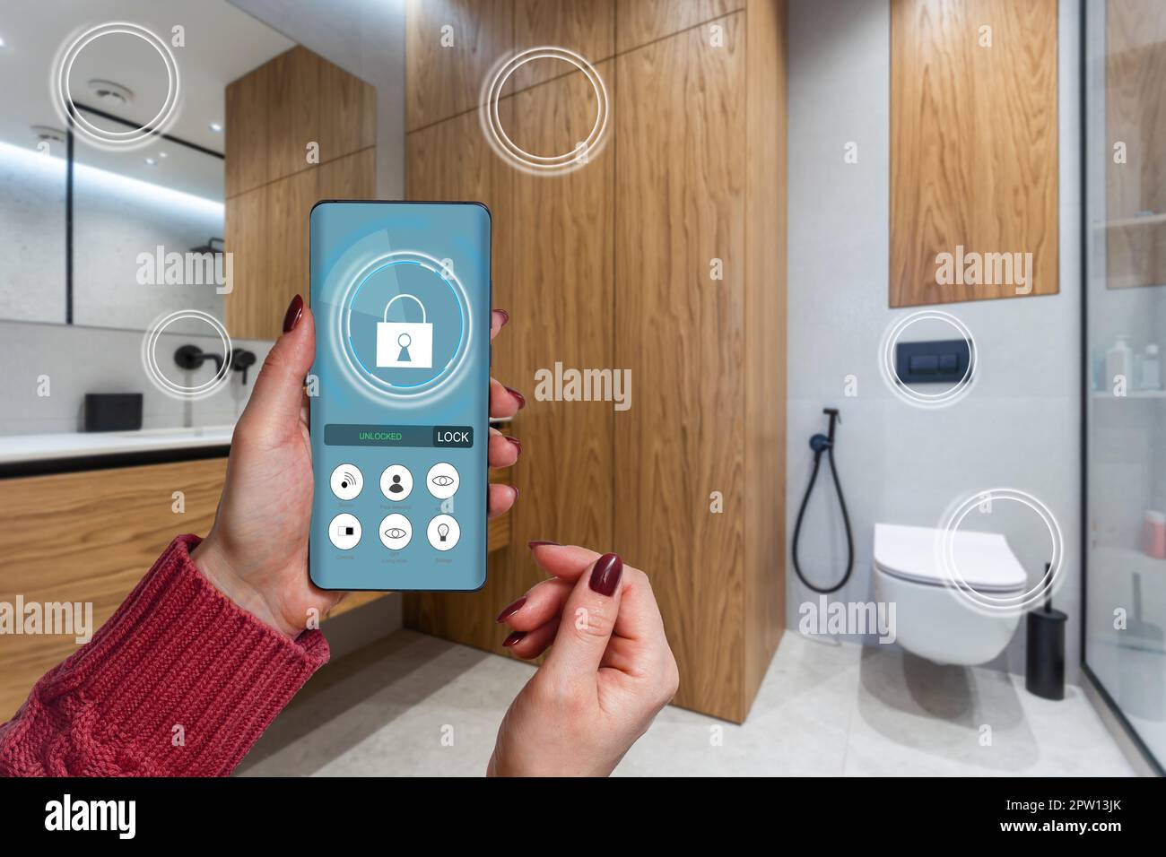 All the house in a phone. Close up of young woman user hands ...