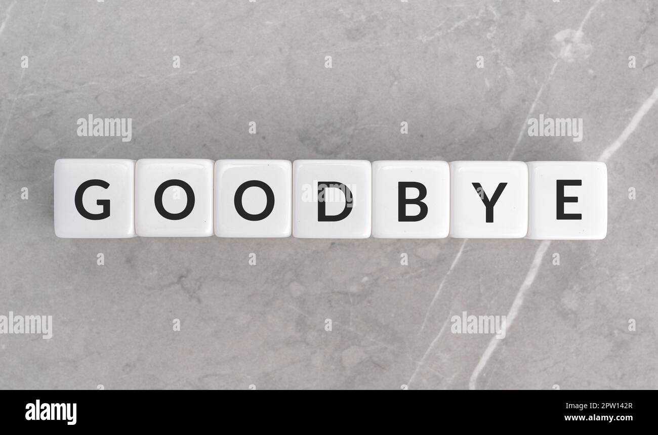 Goodbye word on white blocks on gray marble background Stock Photo - Alamy