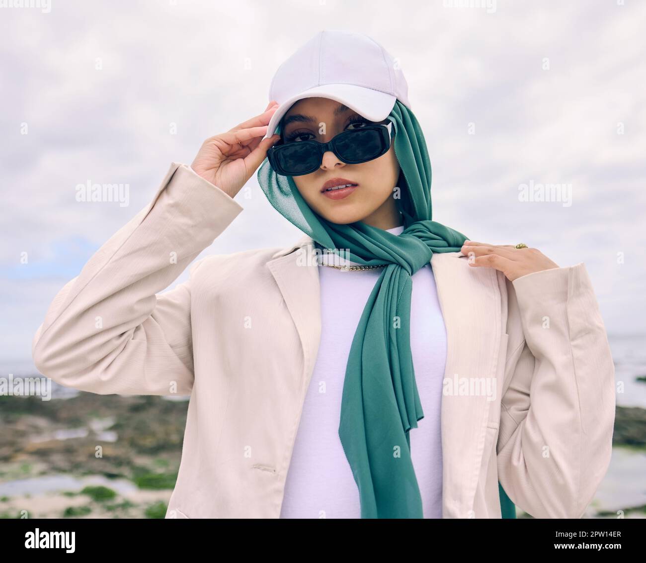 Beautiful young arab woman posing outdoors in a headscarf. Attractive ...